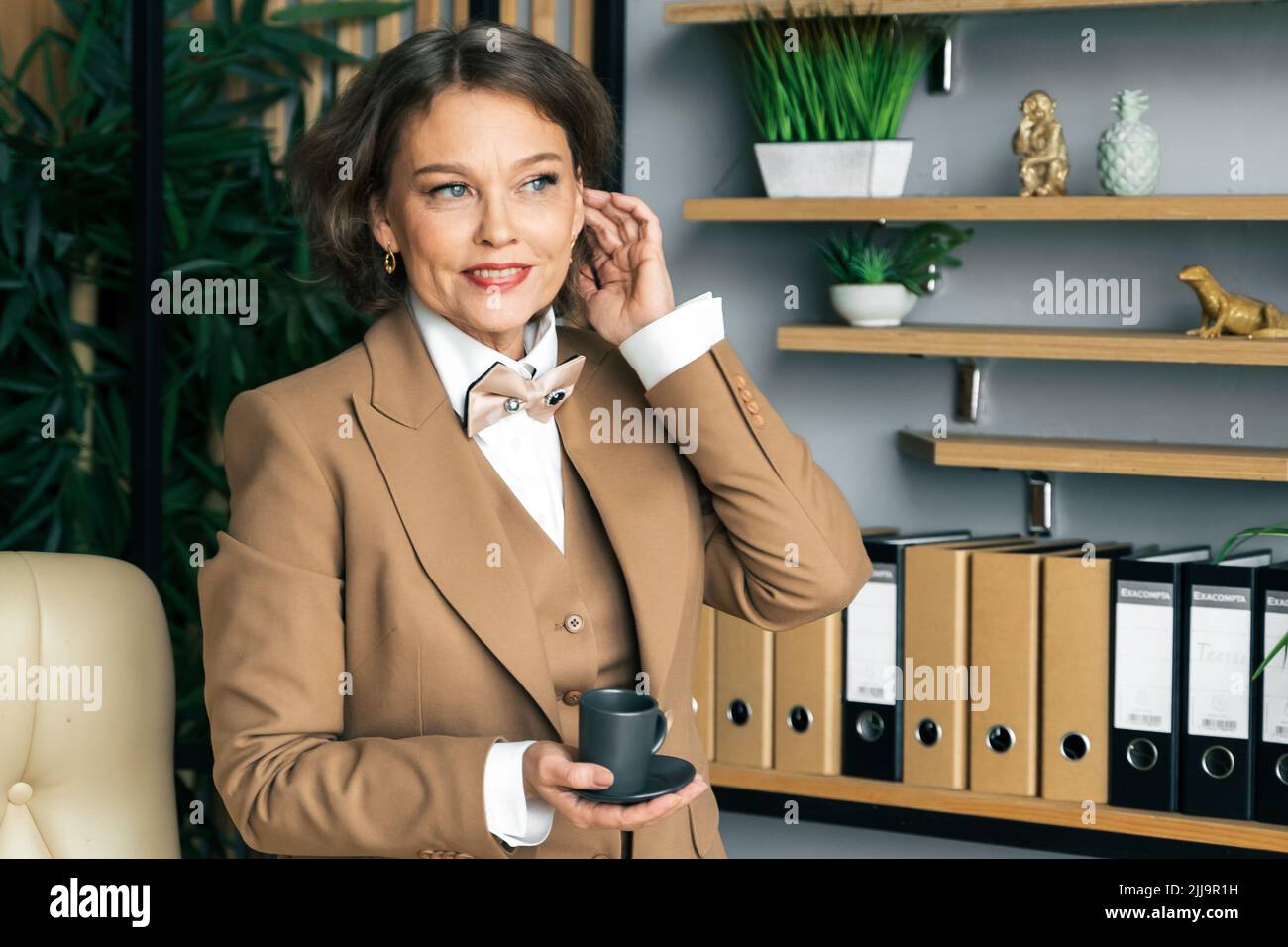 Confident stylish mature middle aged elderly woman in office. General ...