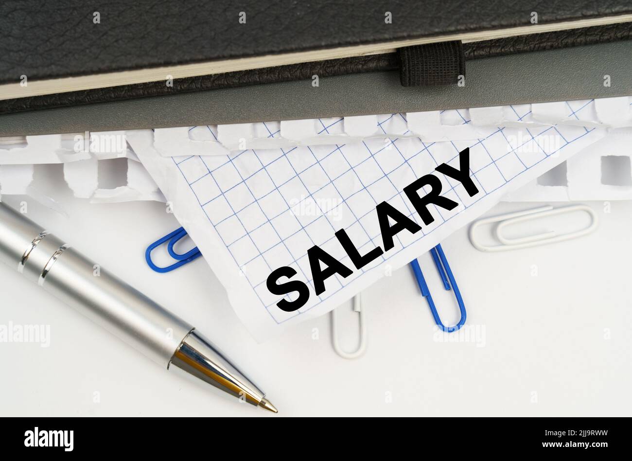 Business concept. On the table is a pen, notebooks and a crumpled sheet ...