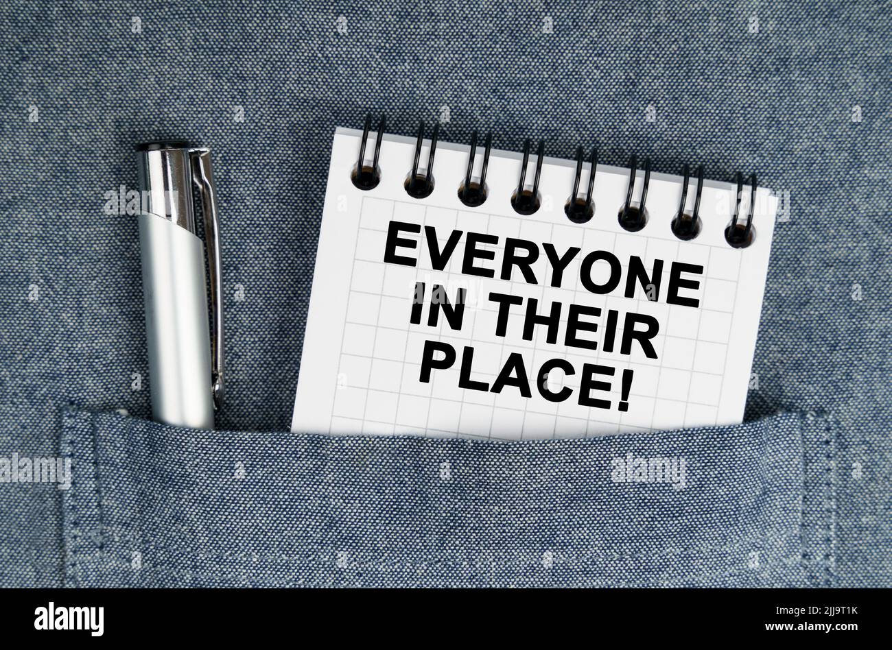 Business and finance concept. In my pocket is a pen and a notebook with ...