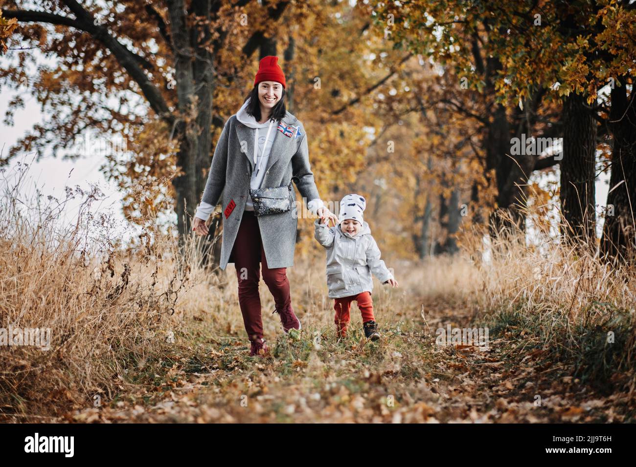 Family Fall Activities. Happy family mom and toddler baby girl playing ...