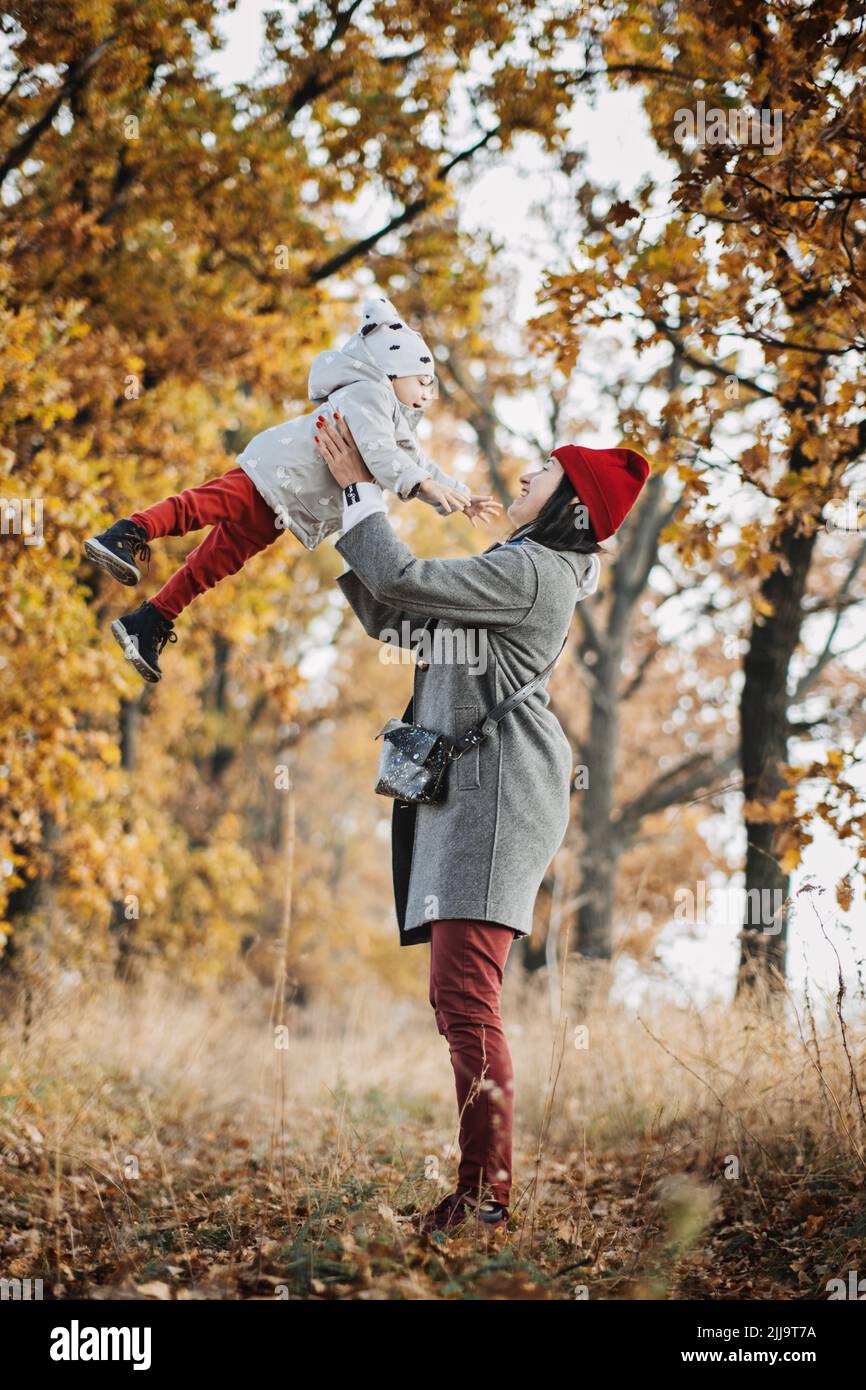 Family Fall Activities. Happy family mom and toddler baby girl playing ...