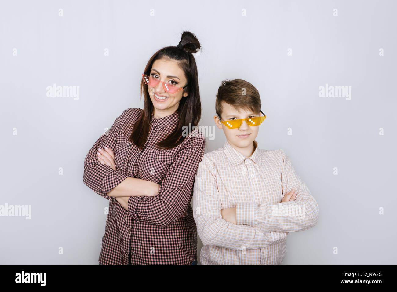 Studio Portrait of happy family mom and teenager son boy in colored ...