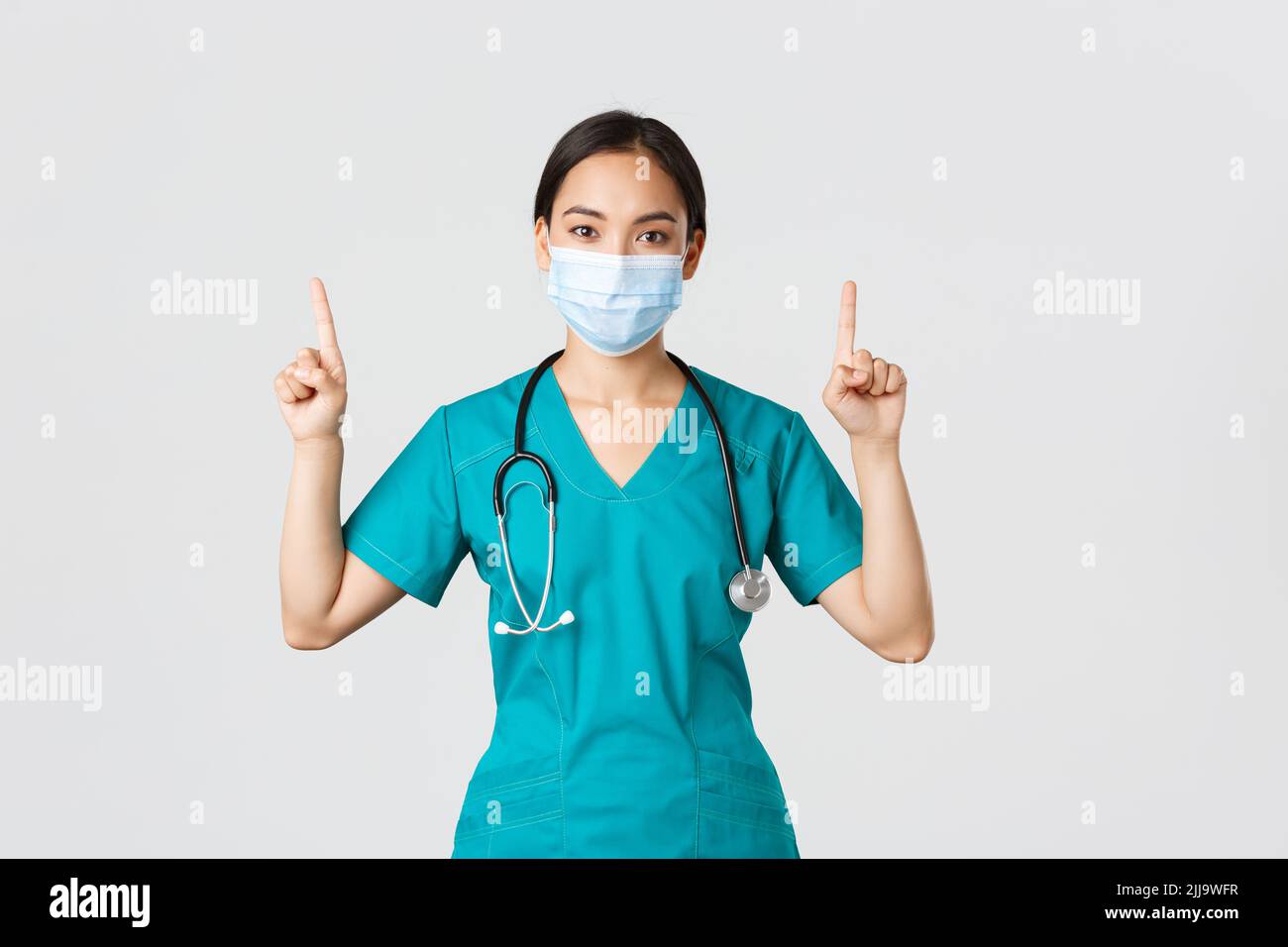 Covid-19, coronavirus disease, healthcare workers concept. Young ... Covid-19, coronavirus disease, healthcare workers concept. Young ...