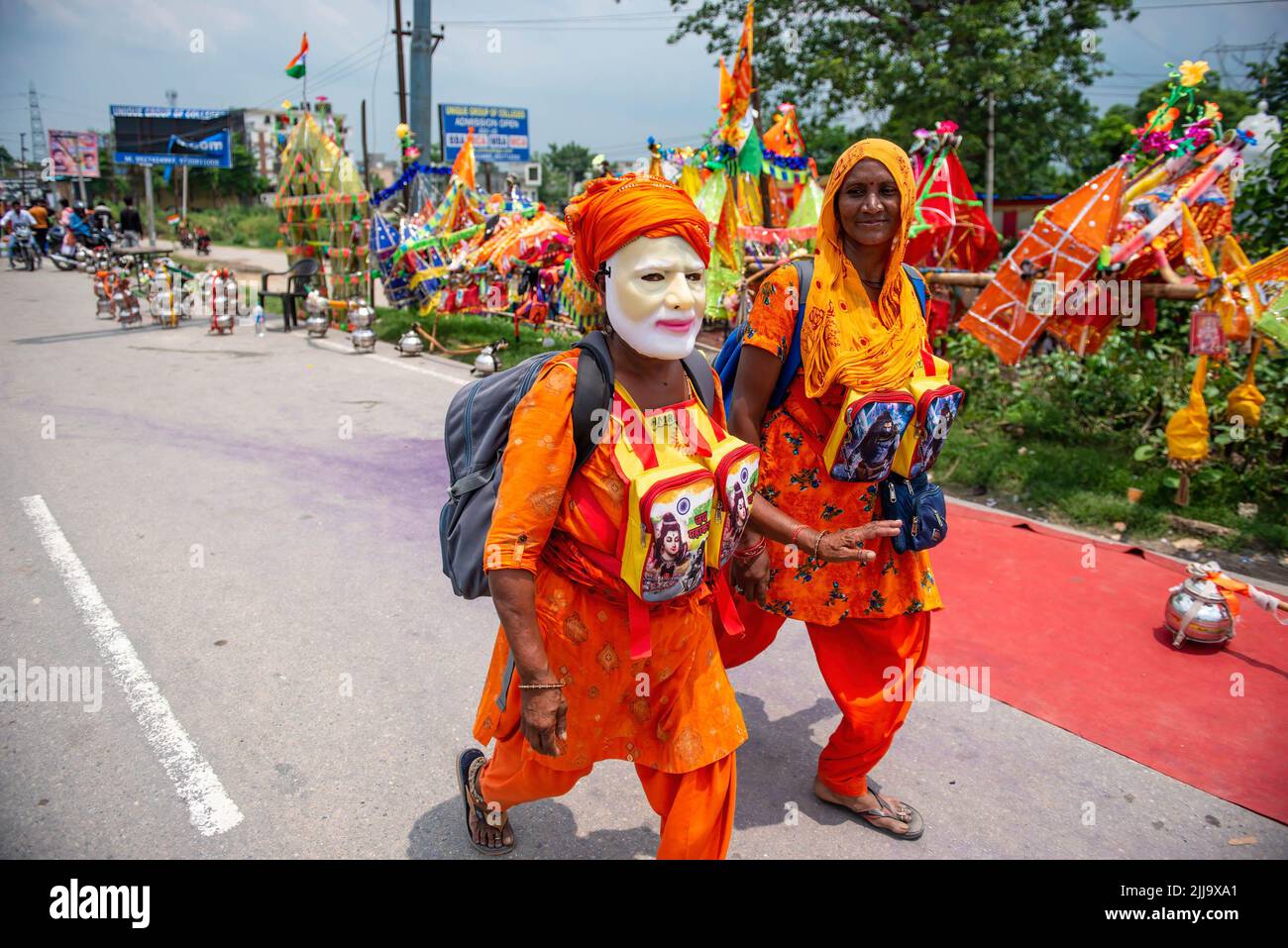 Kanwariya seen wearing a Narendra Modi mask and carrying holy water ...