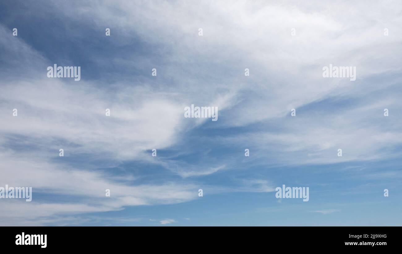 Beautiful wind shaped clouds and blue sky for background use or sky ...