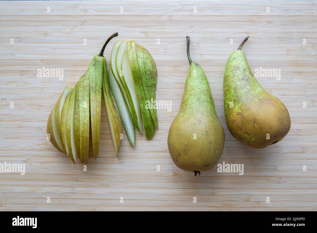Cutting pear on cutting boards, top view, close up Stock Photo - Alamy