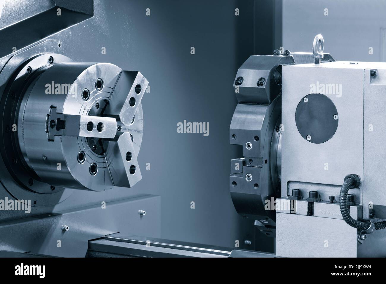Manufacturing CNC professional lathe machine. Industrial concept. Close ...