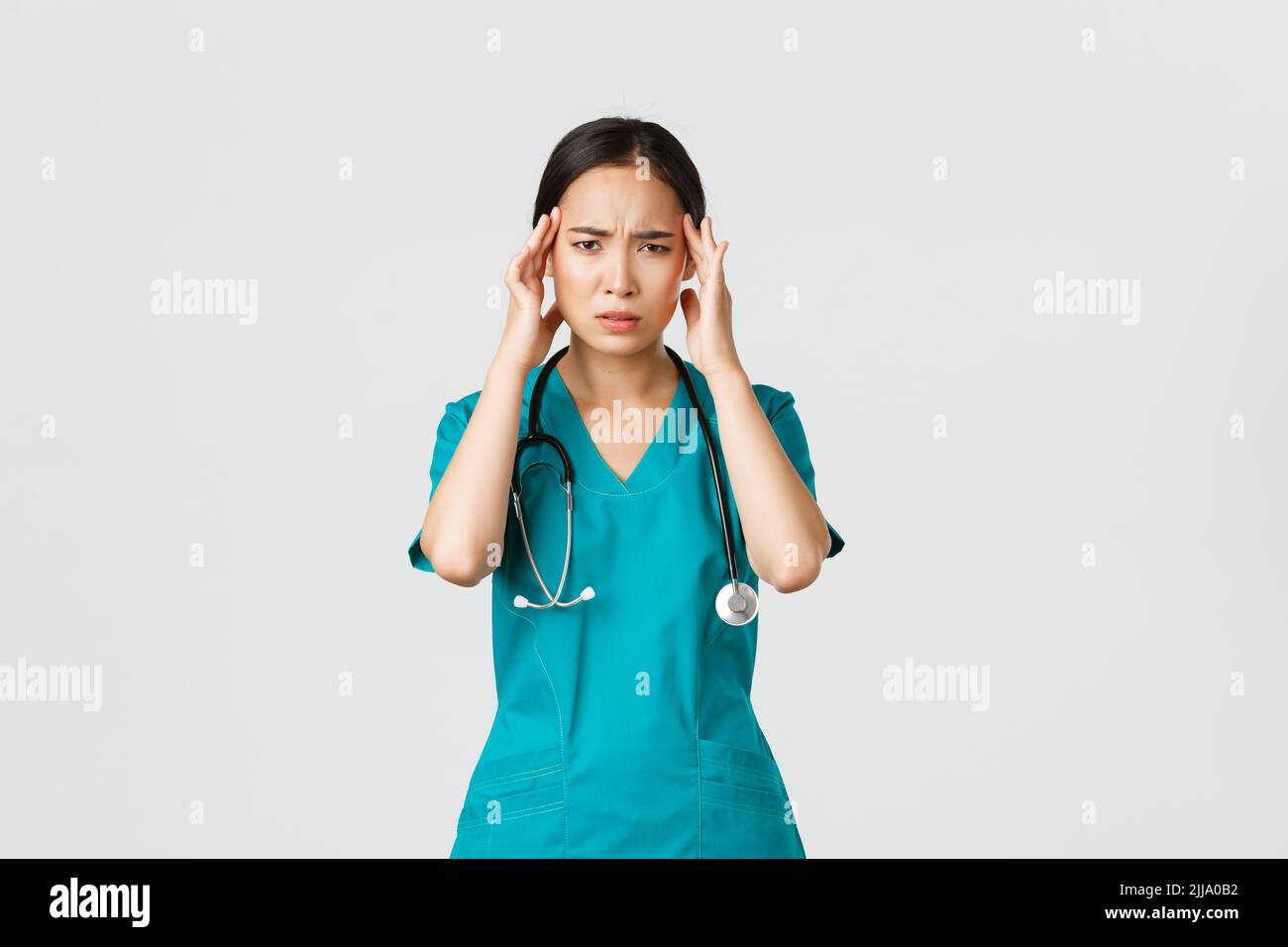 Covid-19, healthcare workers, pandemic concept. Overworked and ...