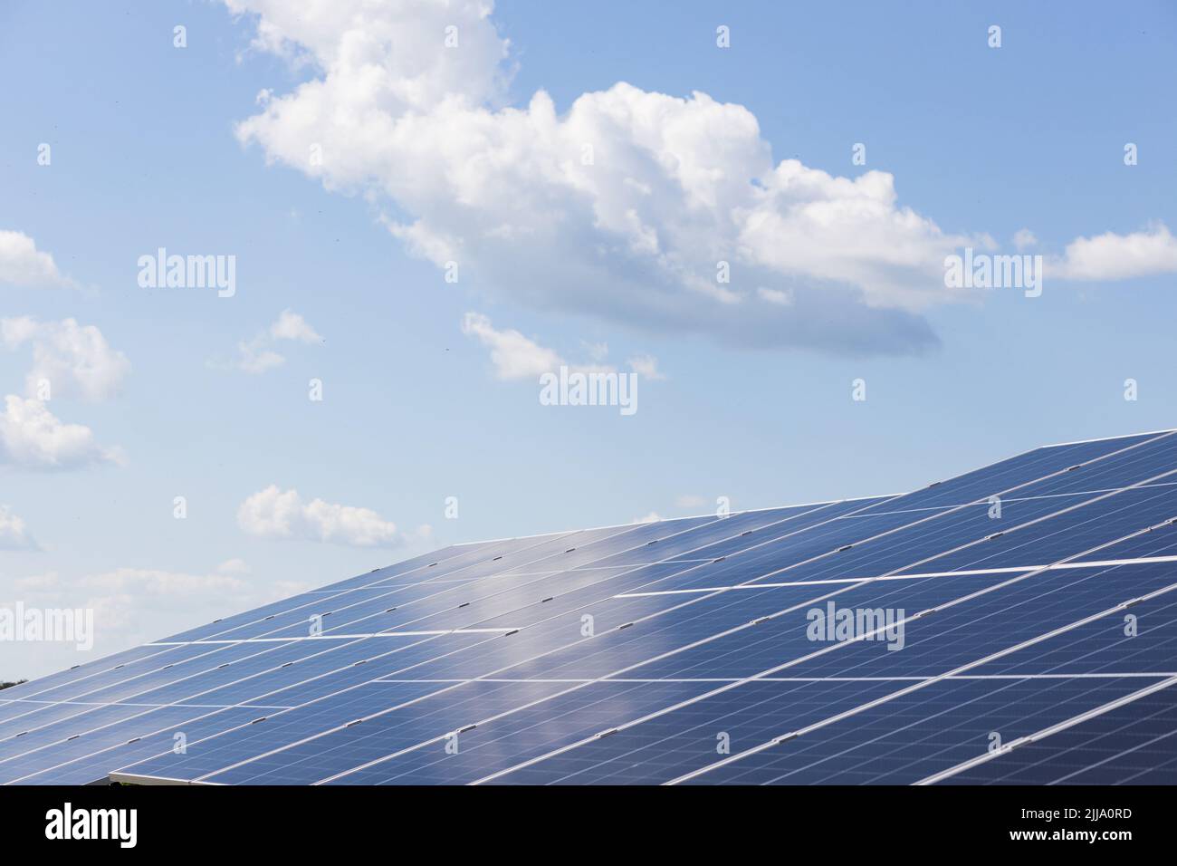 Powerful solar panels on blue sky background, concept of alternative ...
