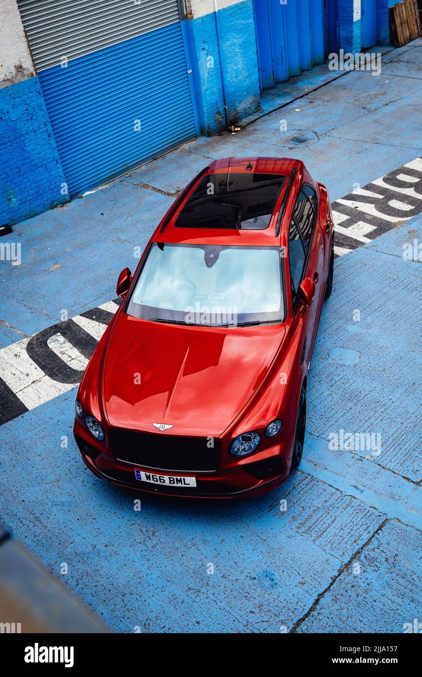 A new red Bentley bentayga in the streets of London, England Stock ...