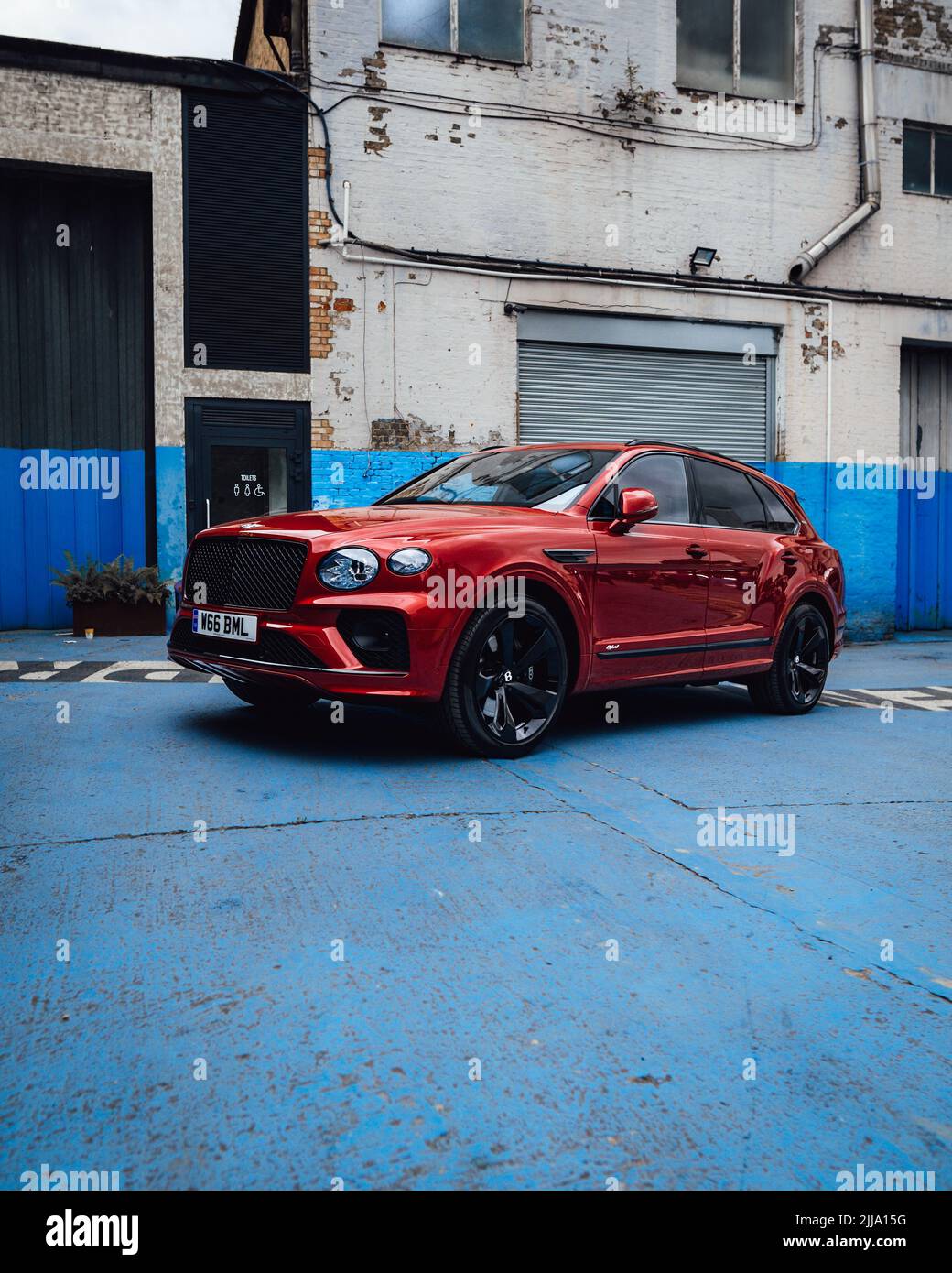 A new red Bentley bentayga in the streets of London, England Stock ...