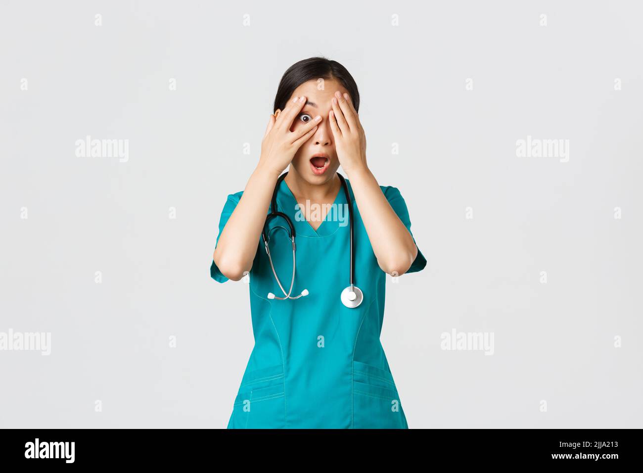 Covid-19, healthcare workers and preventing virus concept. Scared and ...