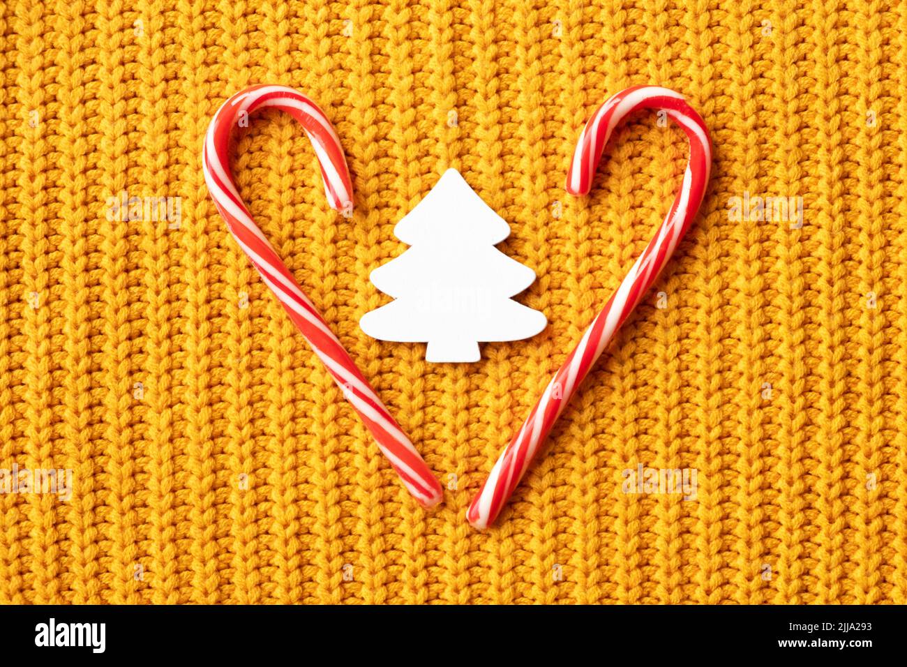 Candy cane heart and wooden tree in middle for christmas design on ...