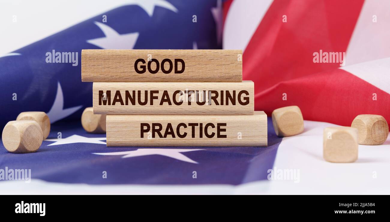 Business concept. The American flag has wooden cubes and plaques that ... Business concept. The American flag has wooden cubes and plaques that ...