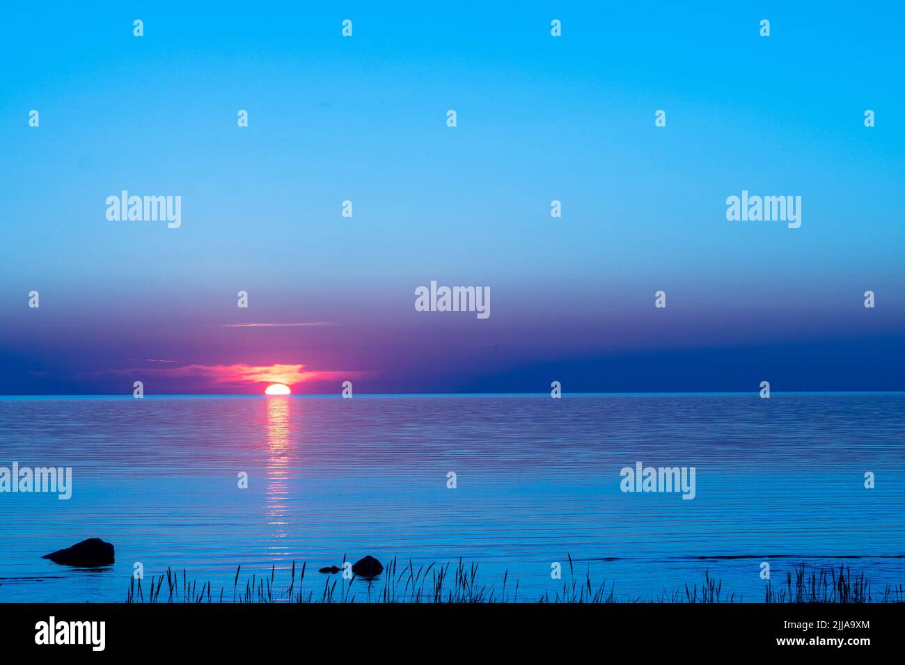 beautiful red sunset sun on the sea on the surface of the water Stock ...