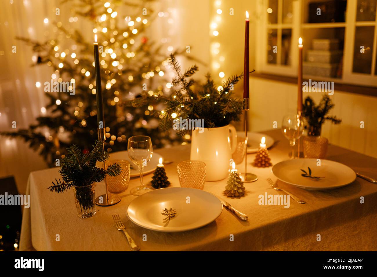 Christmas decor in the setting of a festive table for lunch or dinner ...