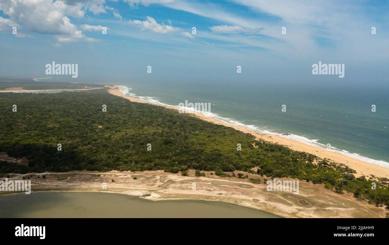 Wild beach in the national park surrounded by rainforest and jungle ...