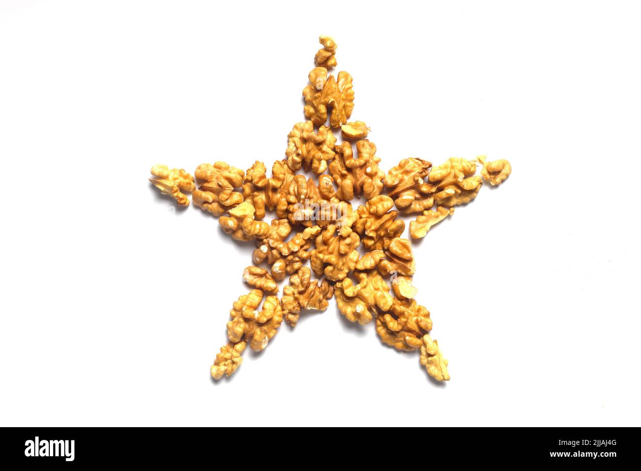 walnut in the shape of a star on a white background Stock Photo - Alamy