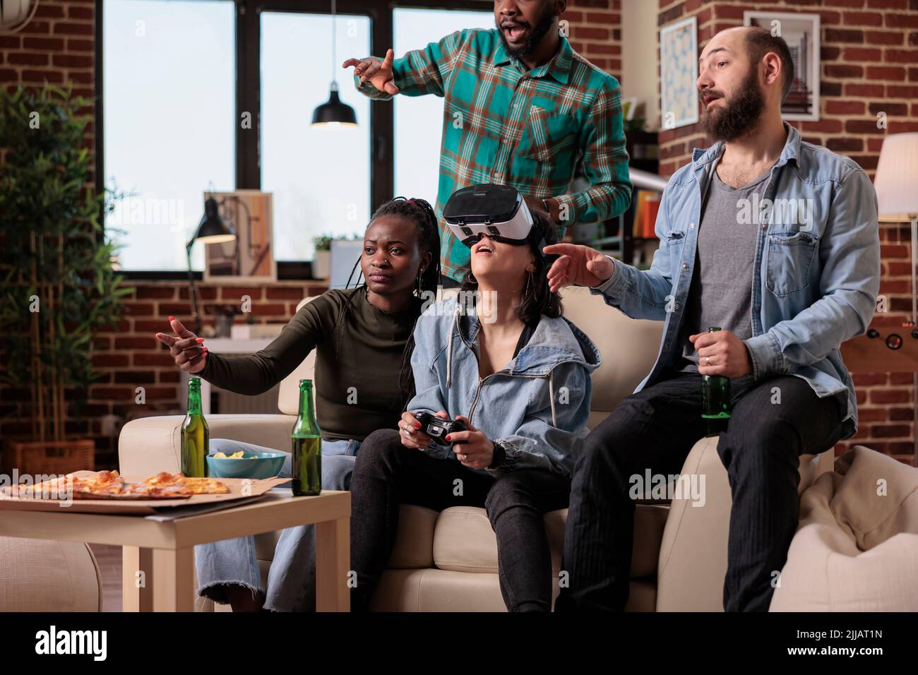 Multiethnic group of people playing video games with vr glasses, using ...