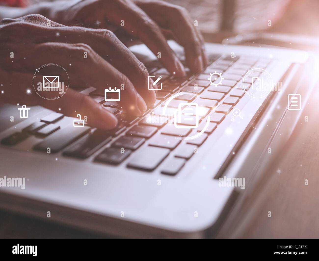 Hands man useing laptop computer with E-commerce technology icons on ...