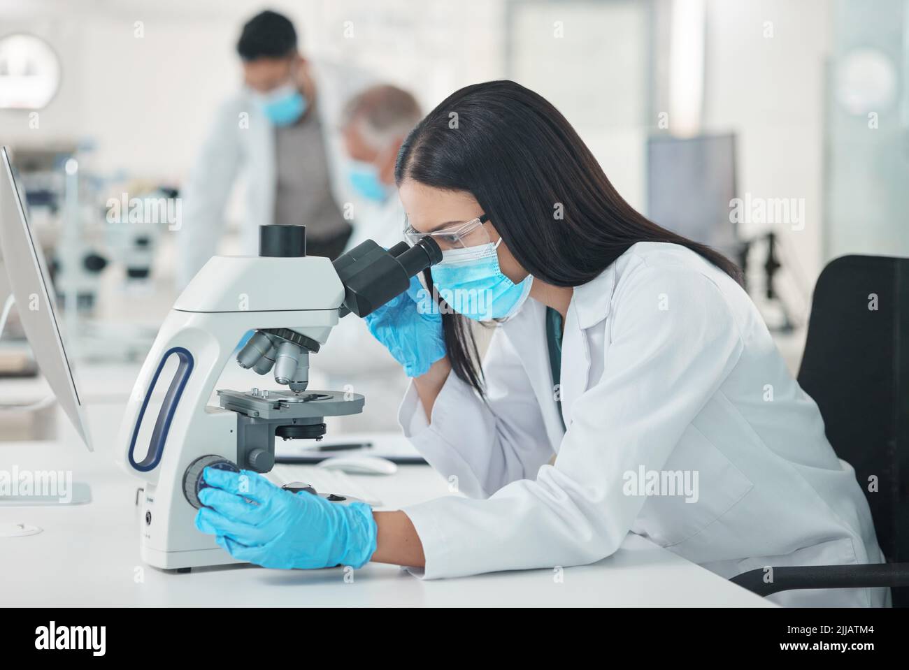 The best way forward is to keep at it. a young scientist using a ...