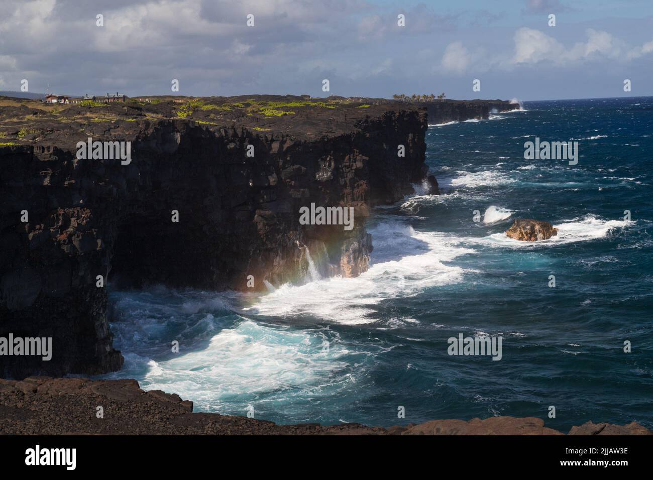 Dramatic cliffs of Hawaii Big Island under dramatic skies Stock Photo ...