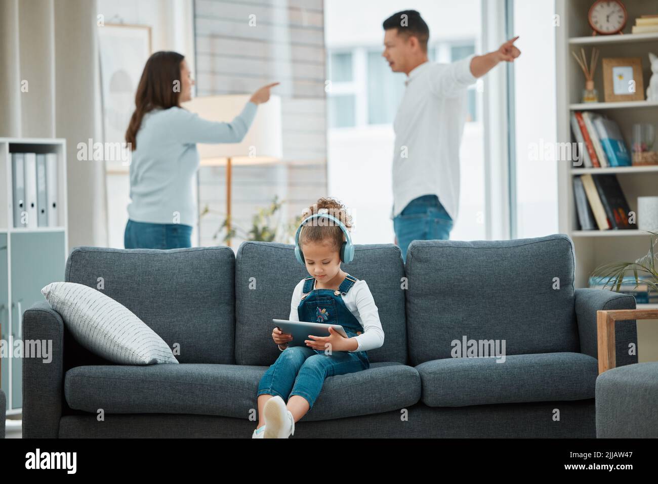 Unaware of the dangers around the corner. a little girl being ...