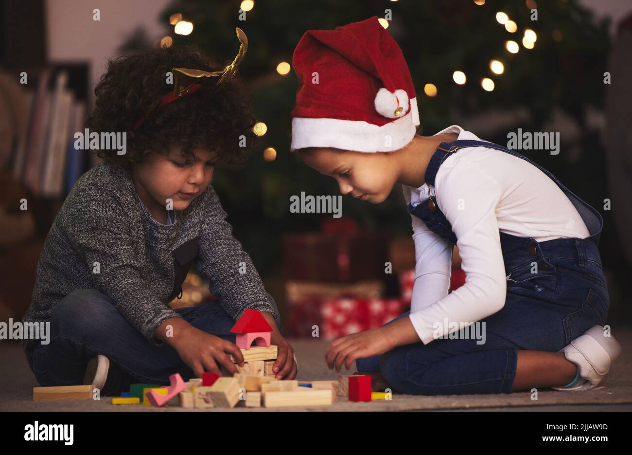 What are we building today. two little siblings playing with blocks ...