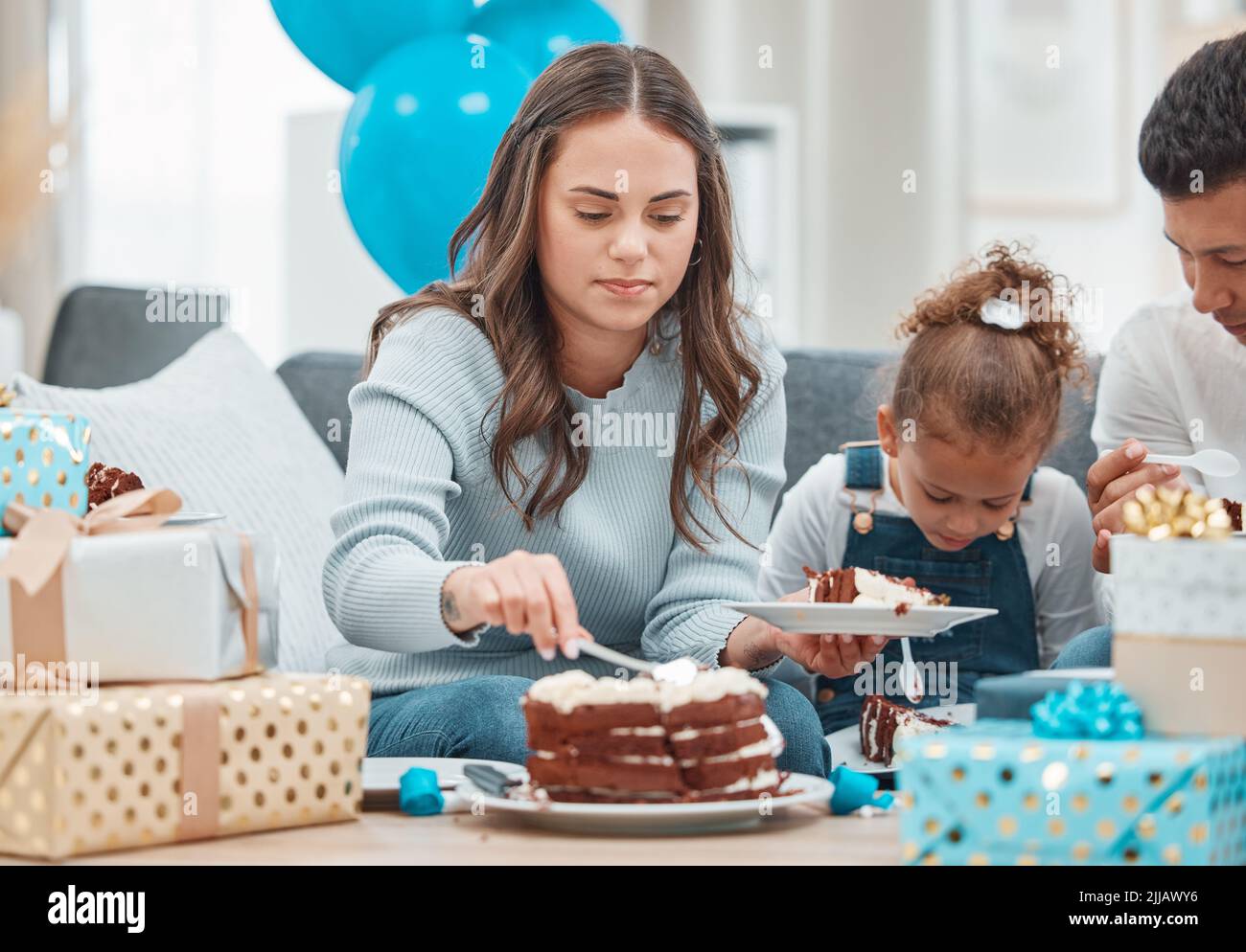 All is quiet when everyones eating cake. a happy family celebrating a ...