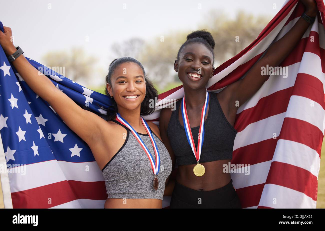 Its an honor to represent your country. Cropped portrait of two ...