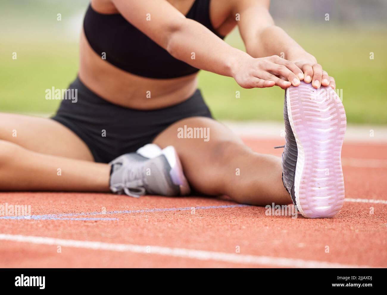 The final stretch. an unrecognizable female athlete going through her ...