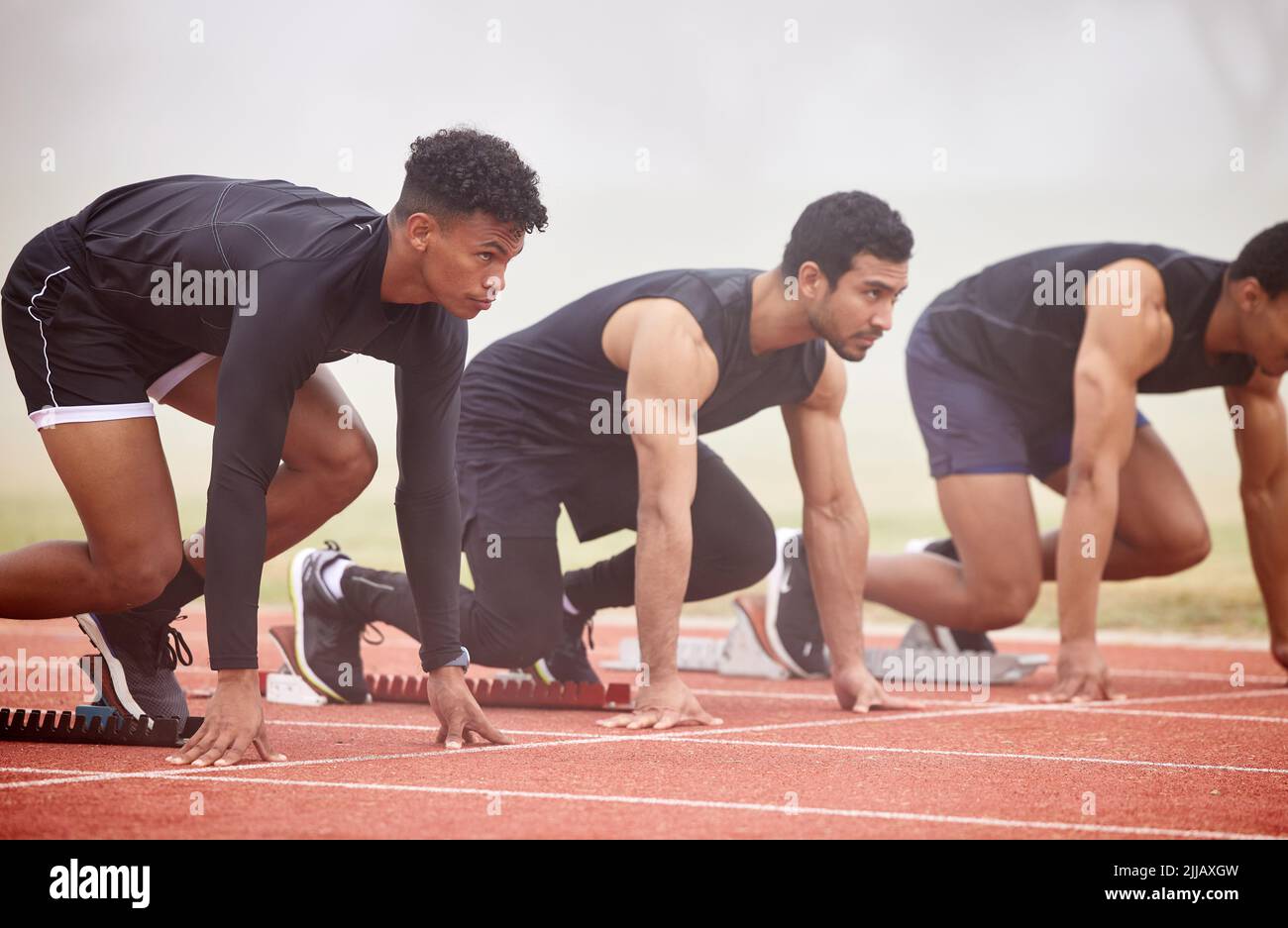 Its not just about pace. three handsome young male athletes starting ...