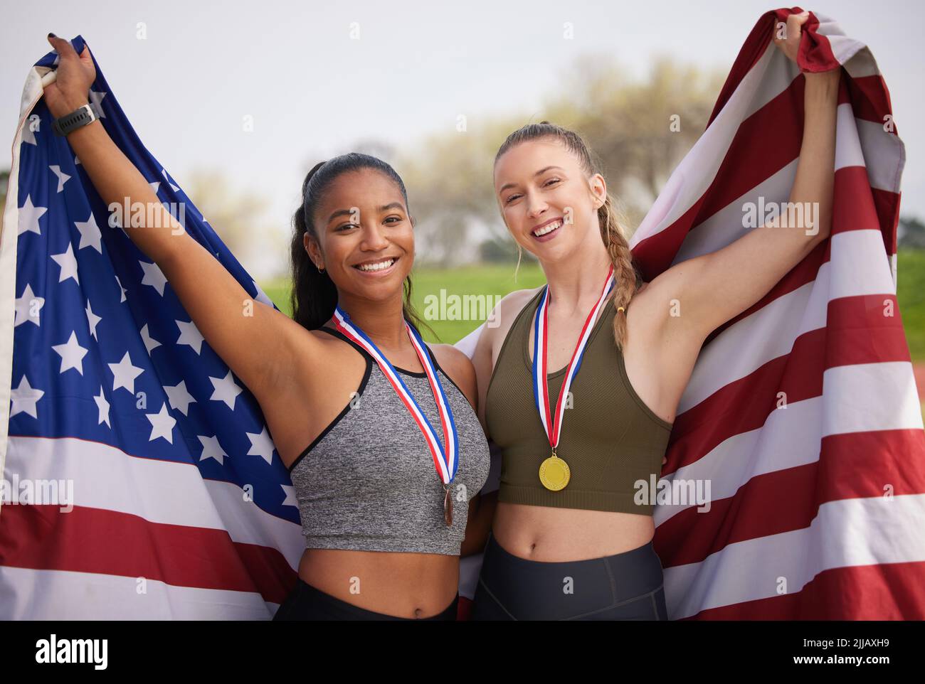 We did our country proud. Cropped portrait of two attractive young ...