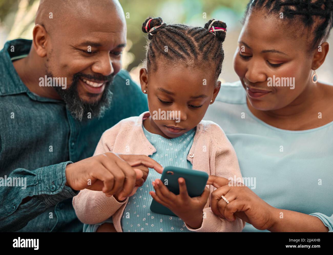 Shes teaching us everything we need to know. a little girl using a ...