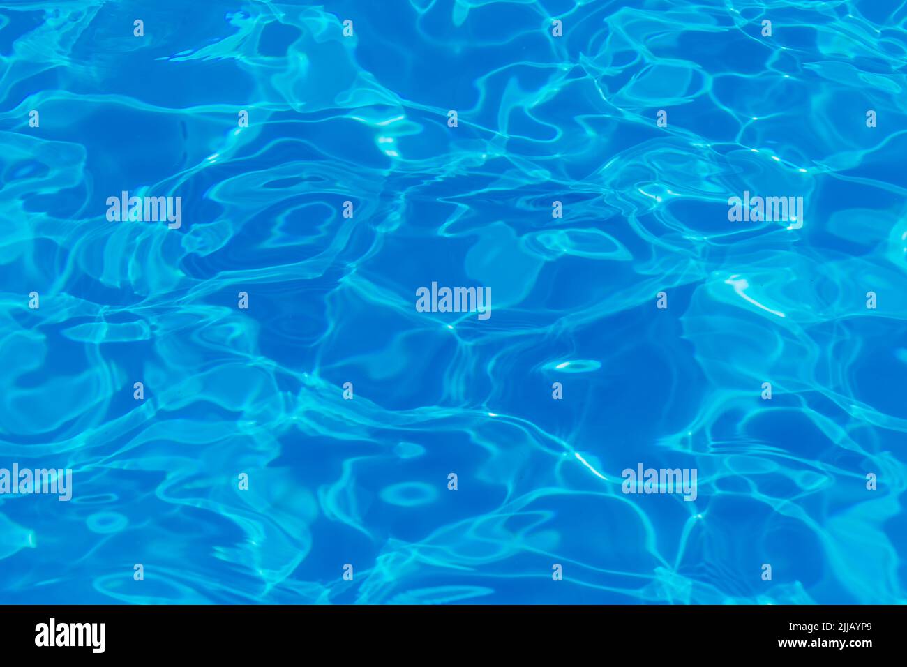 Swimming pool water surface with sparkling light reflections. Aqua ...