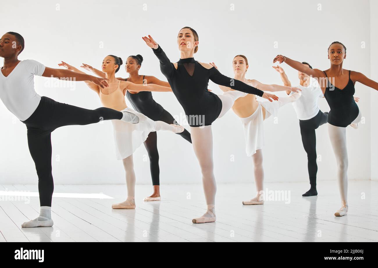 Immerse yourself in every movement. a group of young ballet dancers ...