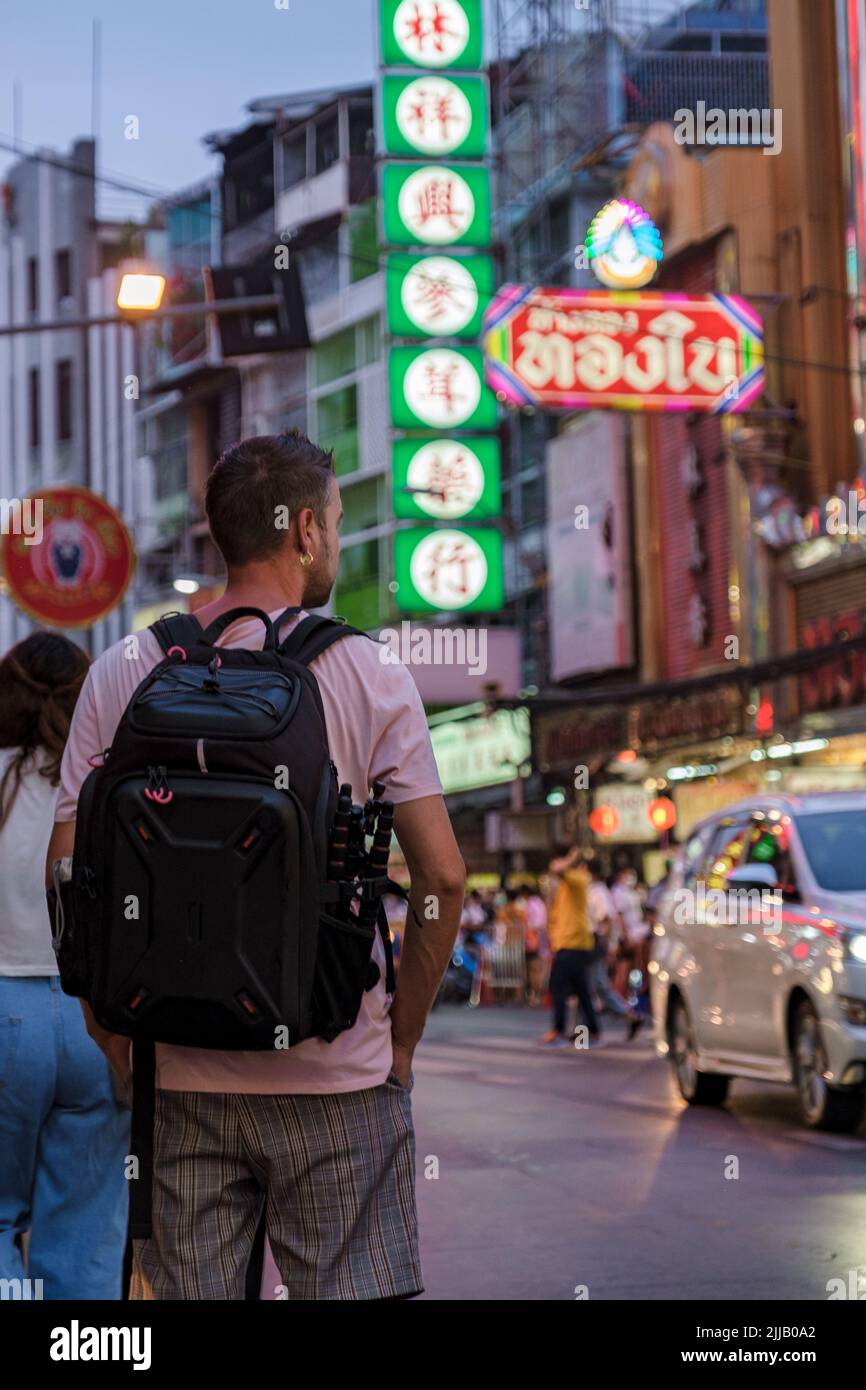 China town Bangkok Thailand, colorful streets of China Town Bangkok.European men with bag ...
