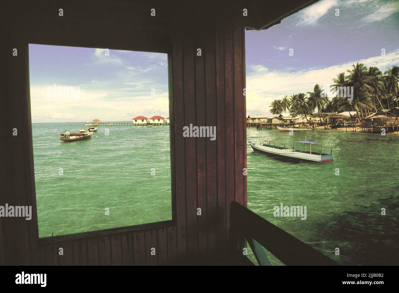A view of fishing village as seen through windows of a cottage built ...