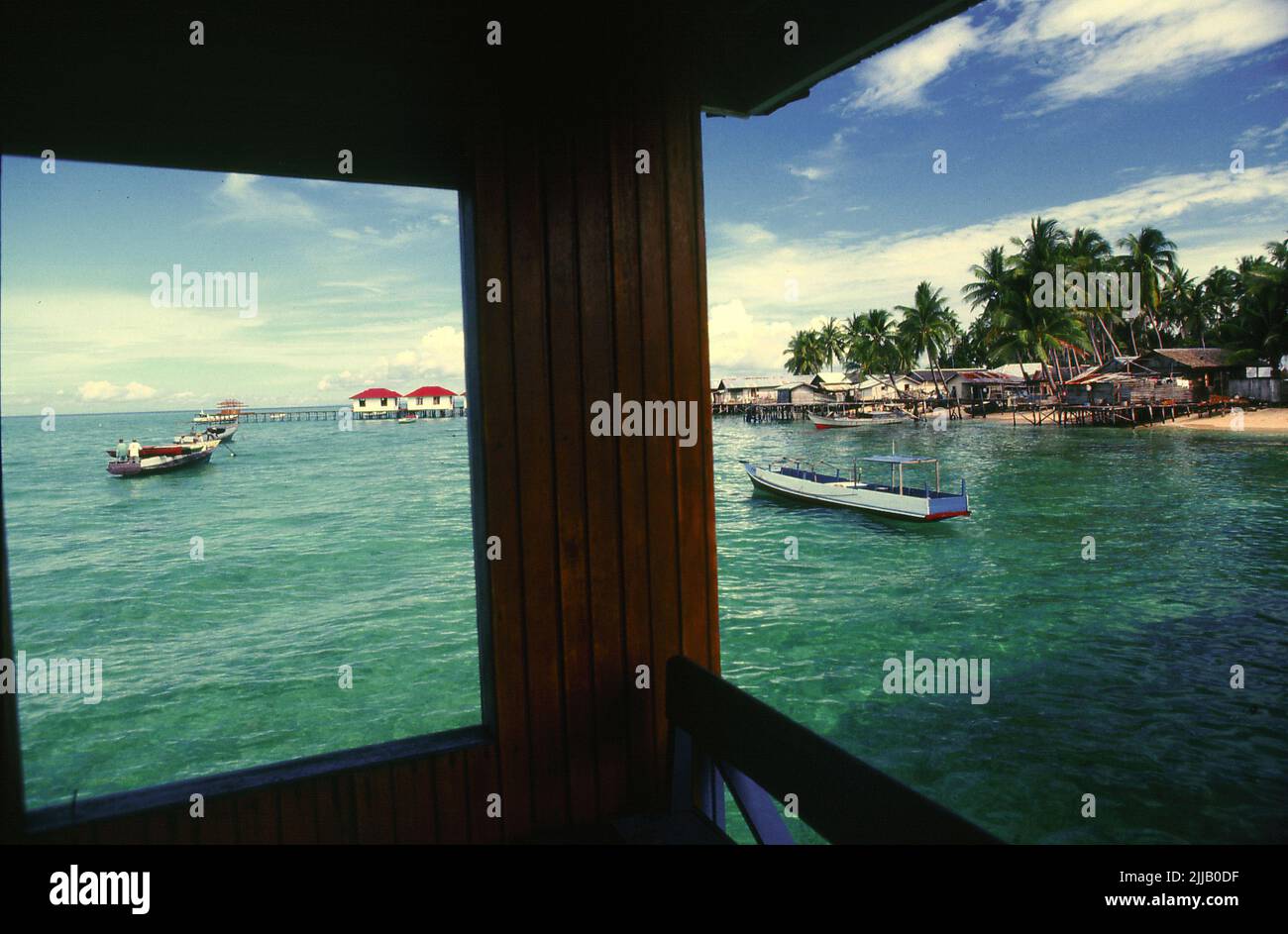 A view of fishing village as seen through windows of a cottage built ...
