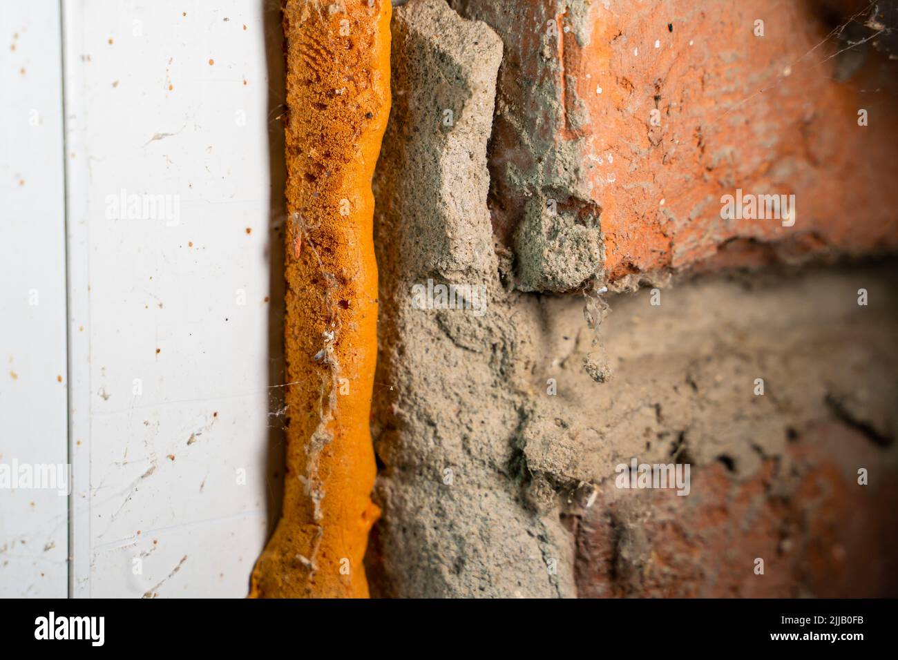 Old polyurethane foam close-up. Corrosion and destruction of building ...