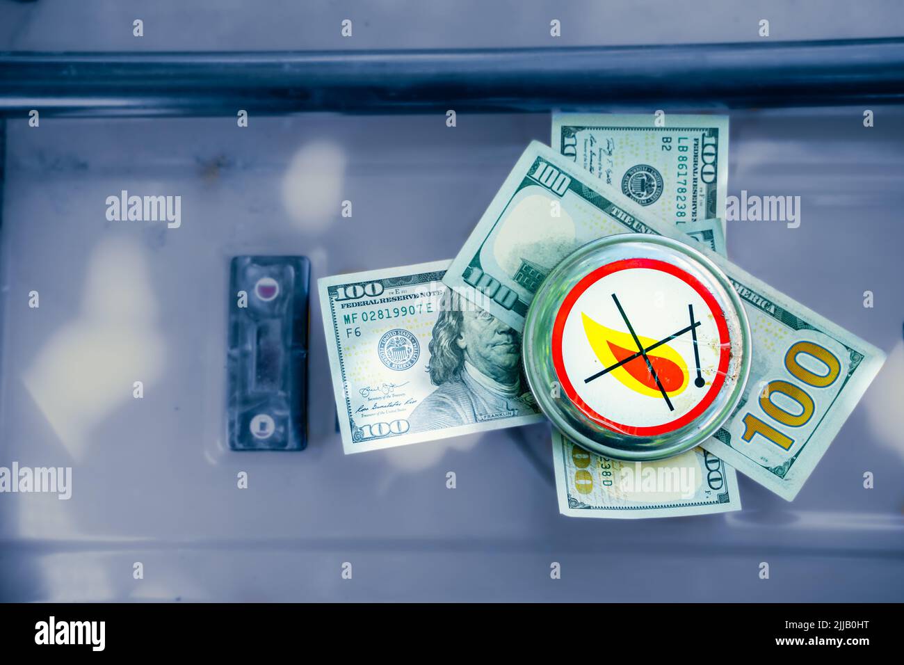 Dollars spent on refueling a tank of fuel. Fuel filler cap pressed ...