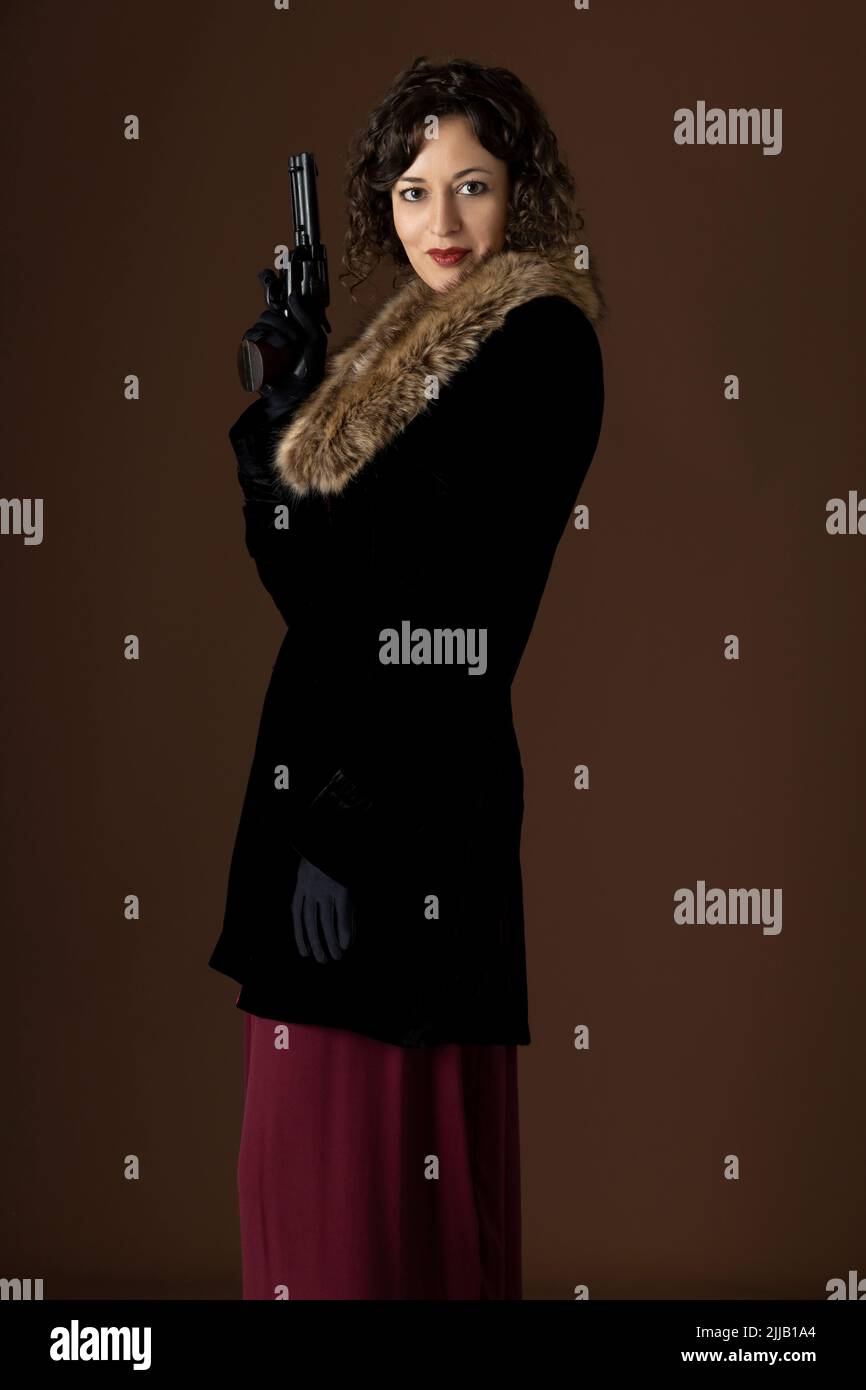 Woman with gun vintage hi-res stock photography and images - Alamy