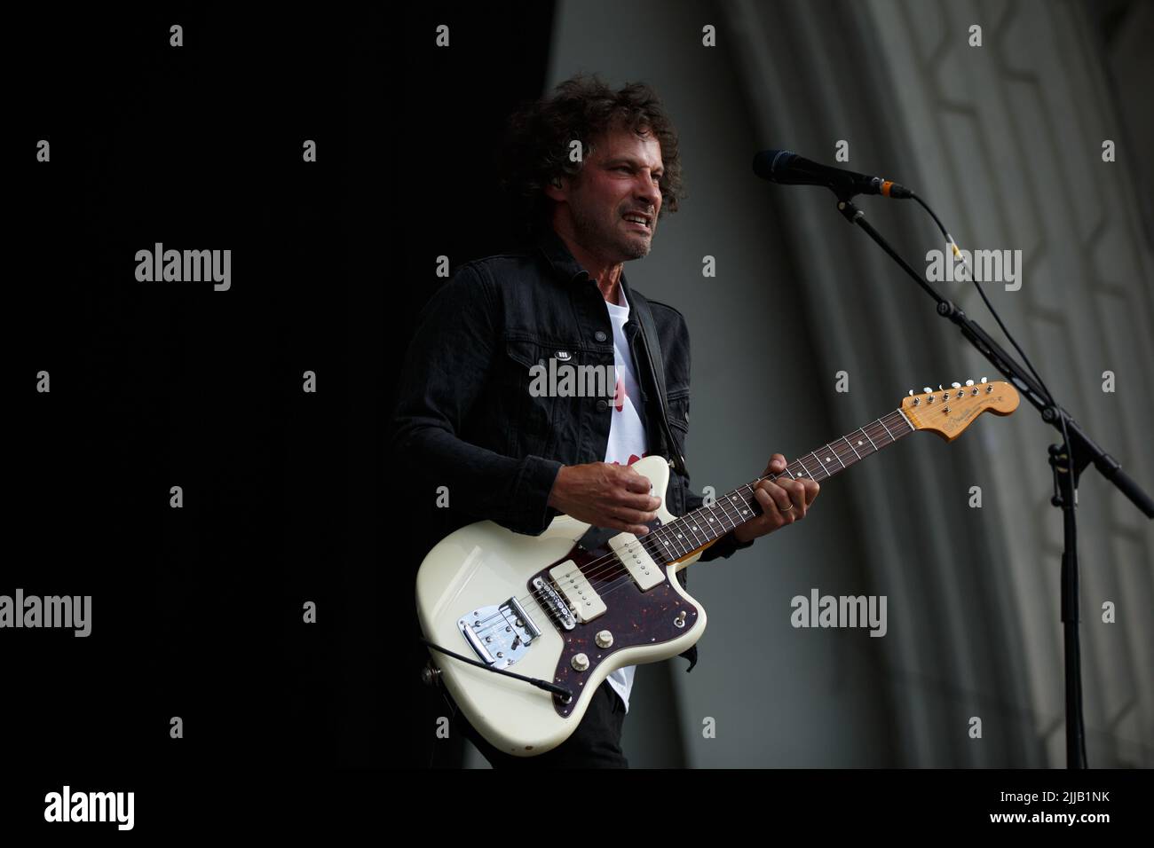 Handsome singer in jeans guitar hi-res stock photography and images - Alamy