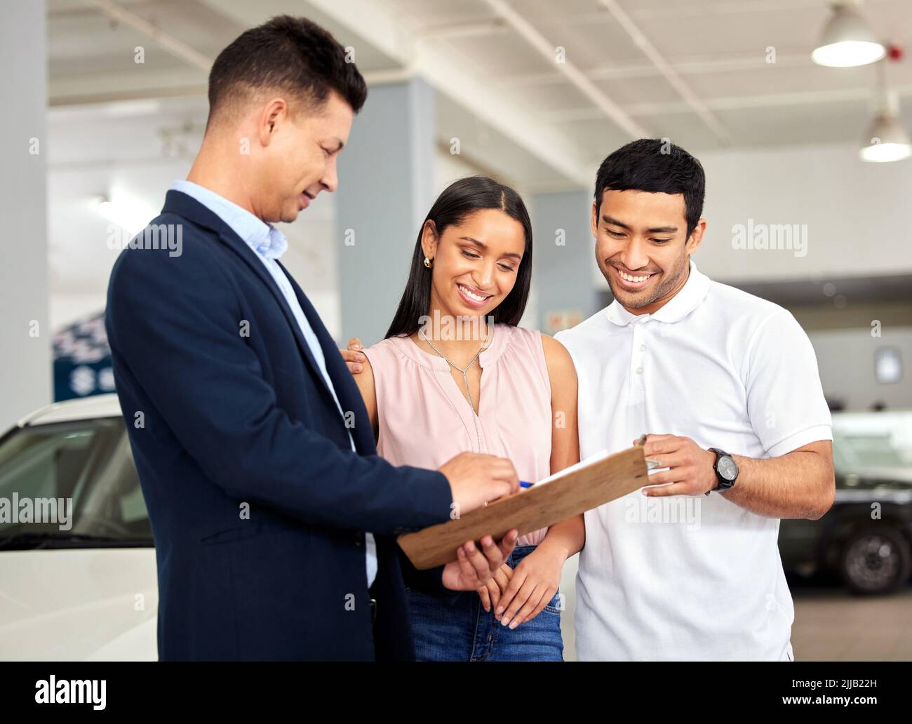 Car salesman and customer paperwork hi-res stock photography and images ...