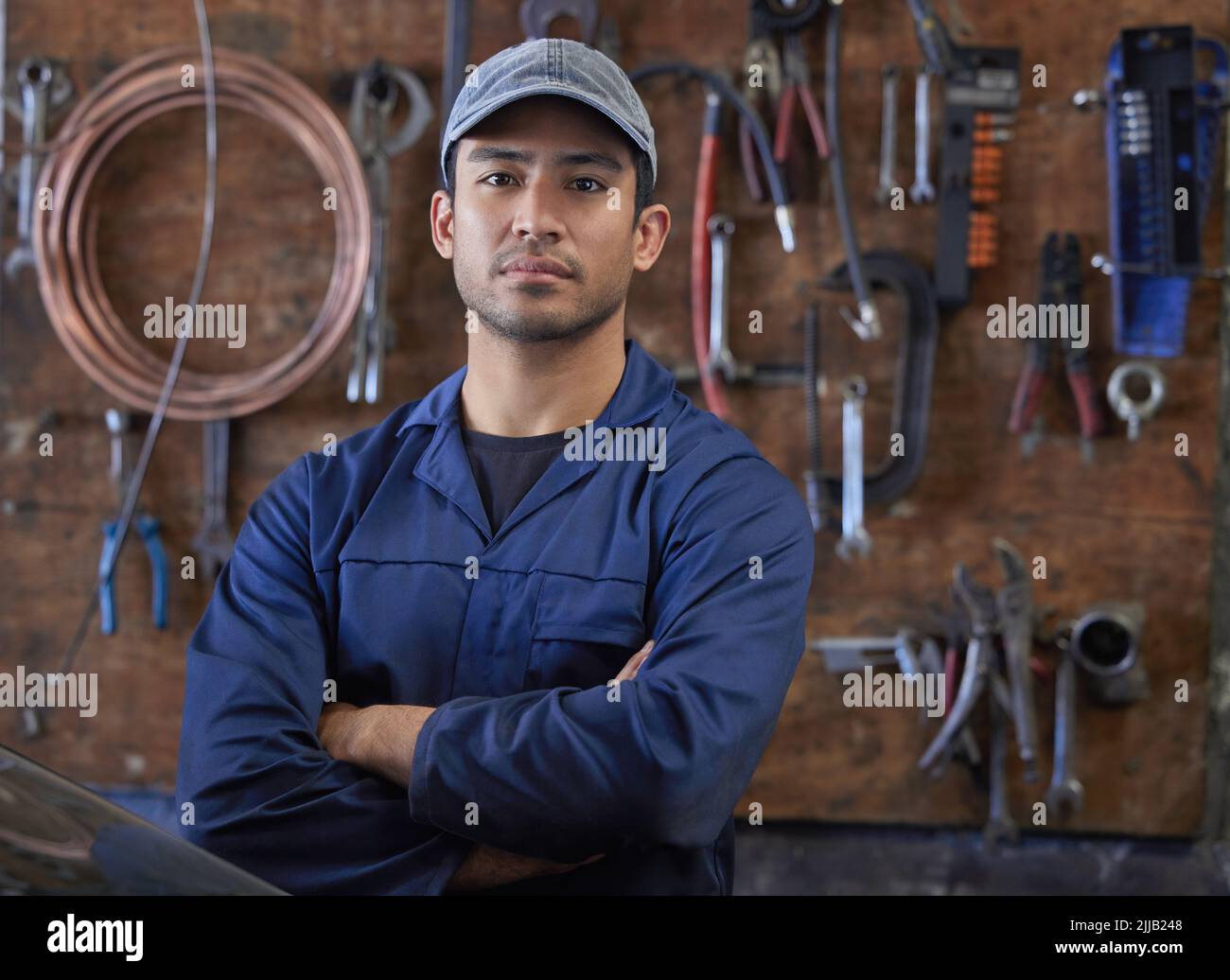The tools of my trade. Cropped portrait of a handsome young male ...