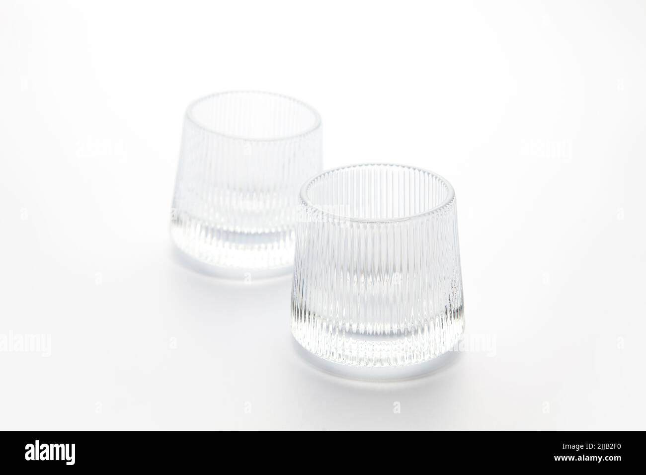 2 drinking glasses isolated on white background Stock Photo - Alamy