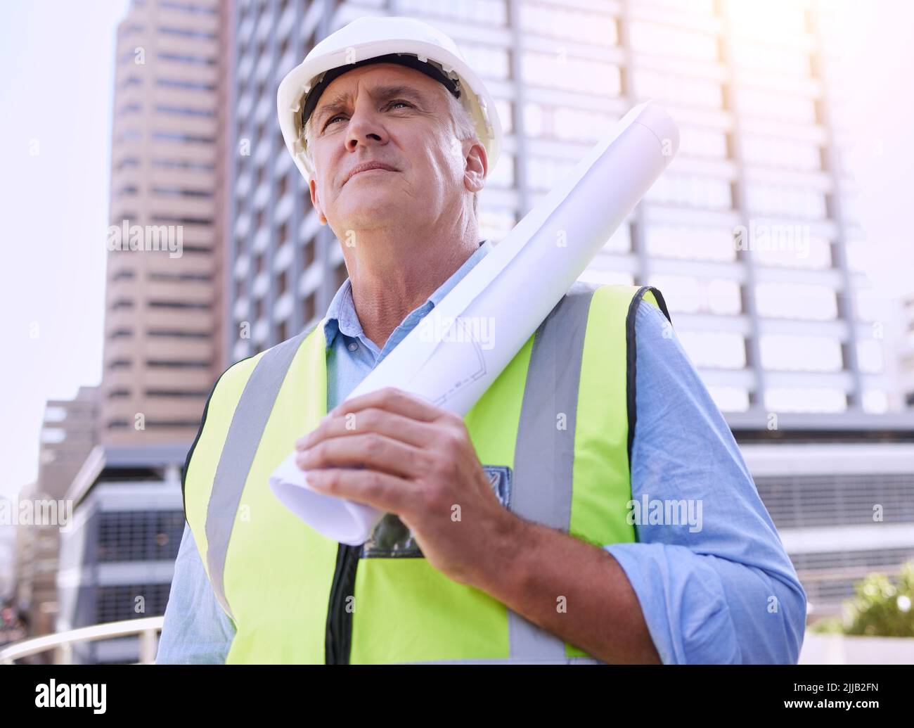 Hes ready to build something great. a handsome mature male construction ...