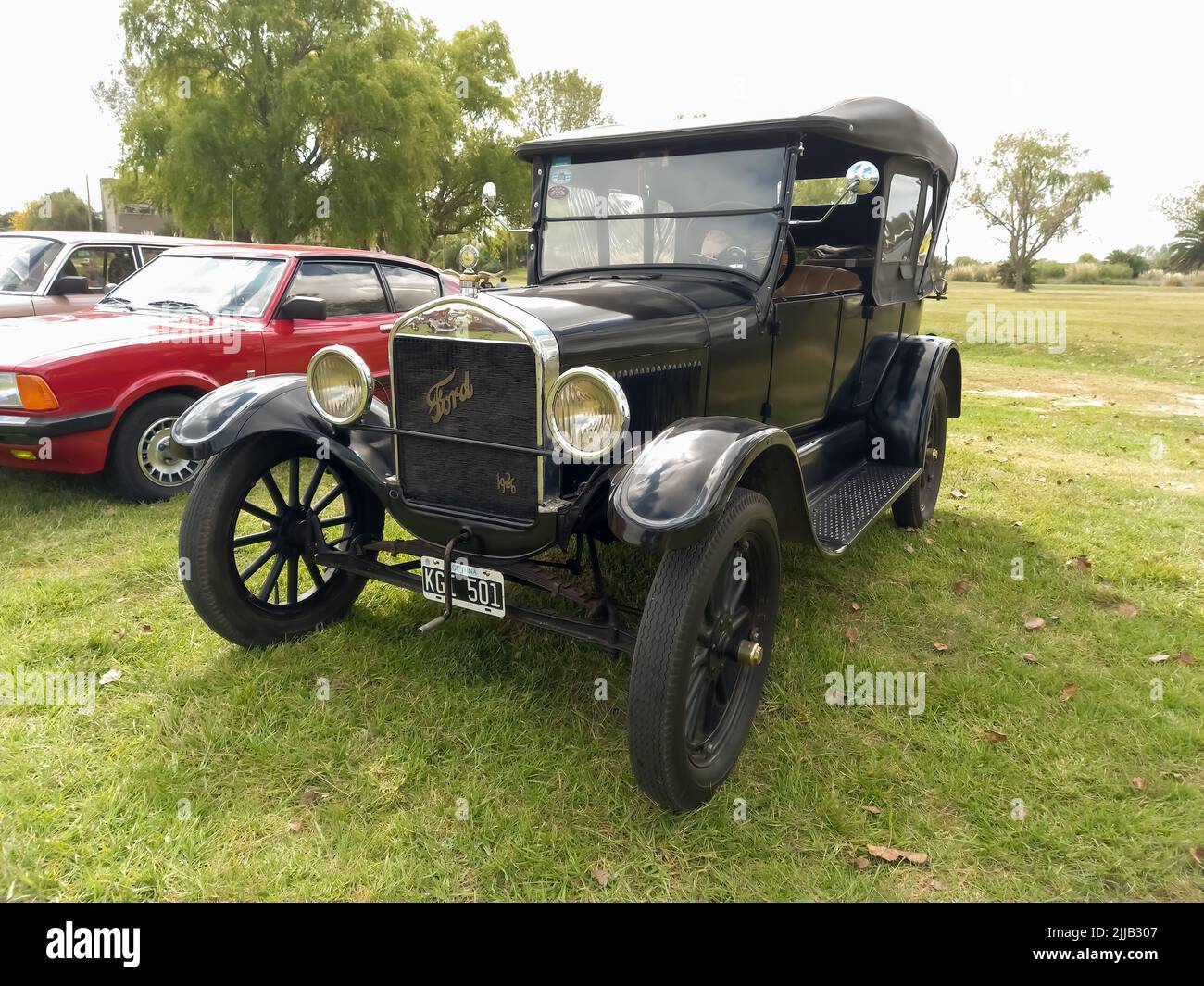 Old black Ford Model T Fordor Phaeton 1926 in the countryside. Nature ...