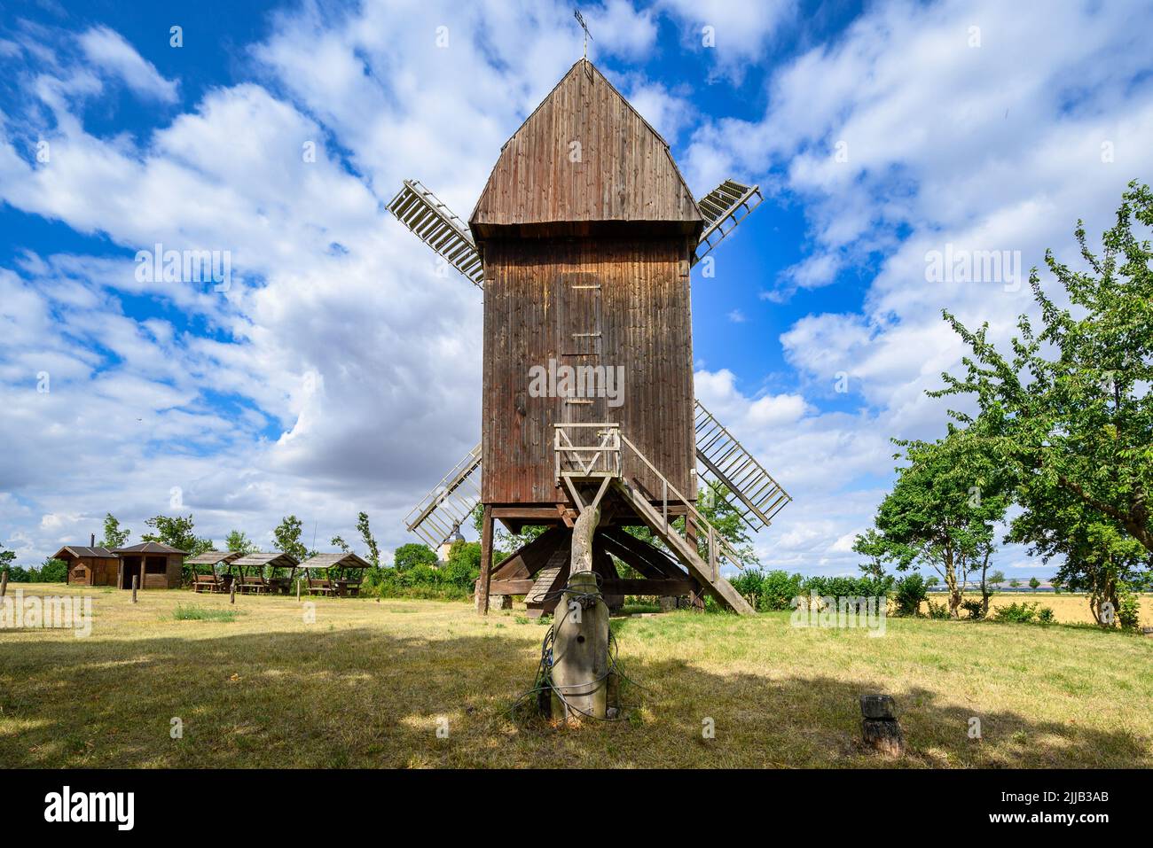 A view of a beautiful windmill in Germany in a natural setting and an ...