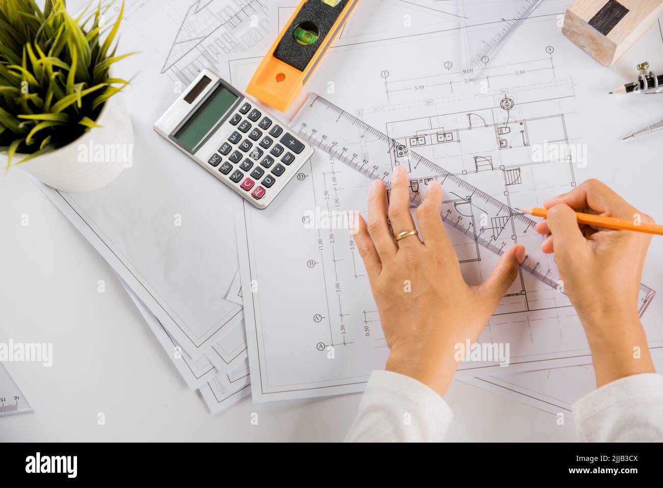 Architectural project workspace. Top view of architect drawing with ...